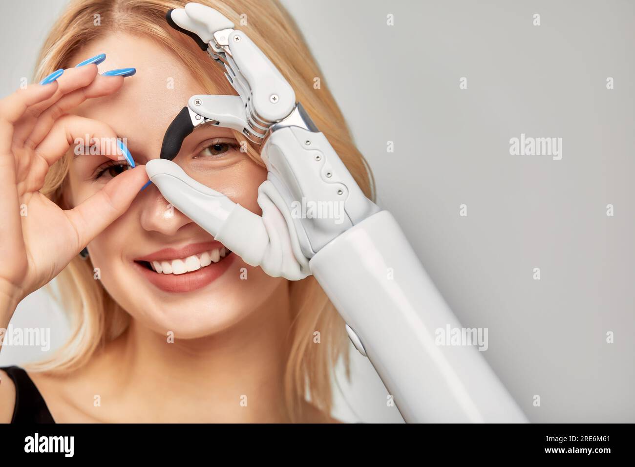 Close up of young charming girl with disability wearing sensory bionic ...
