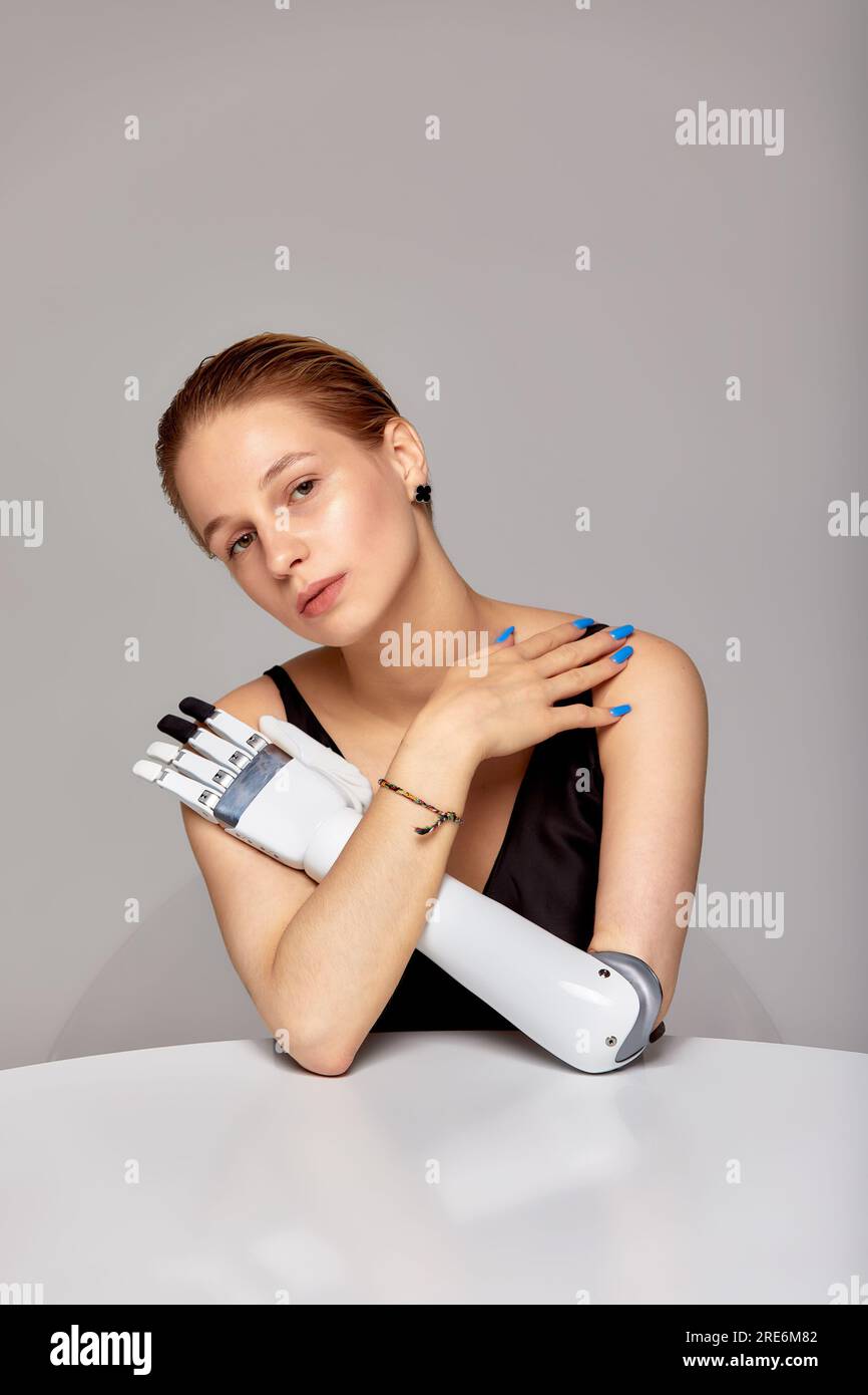 Young charming girl with disability wearing sensory bionic prosthetic ...
