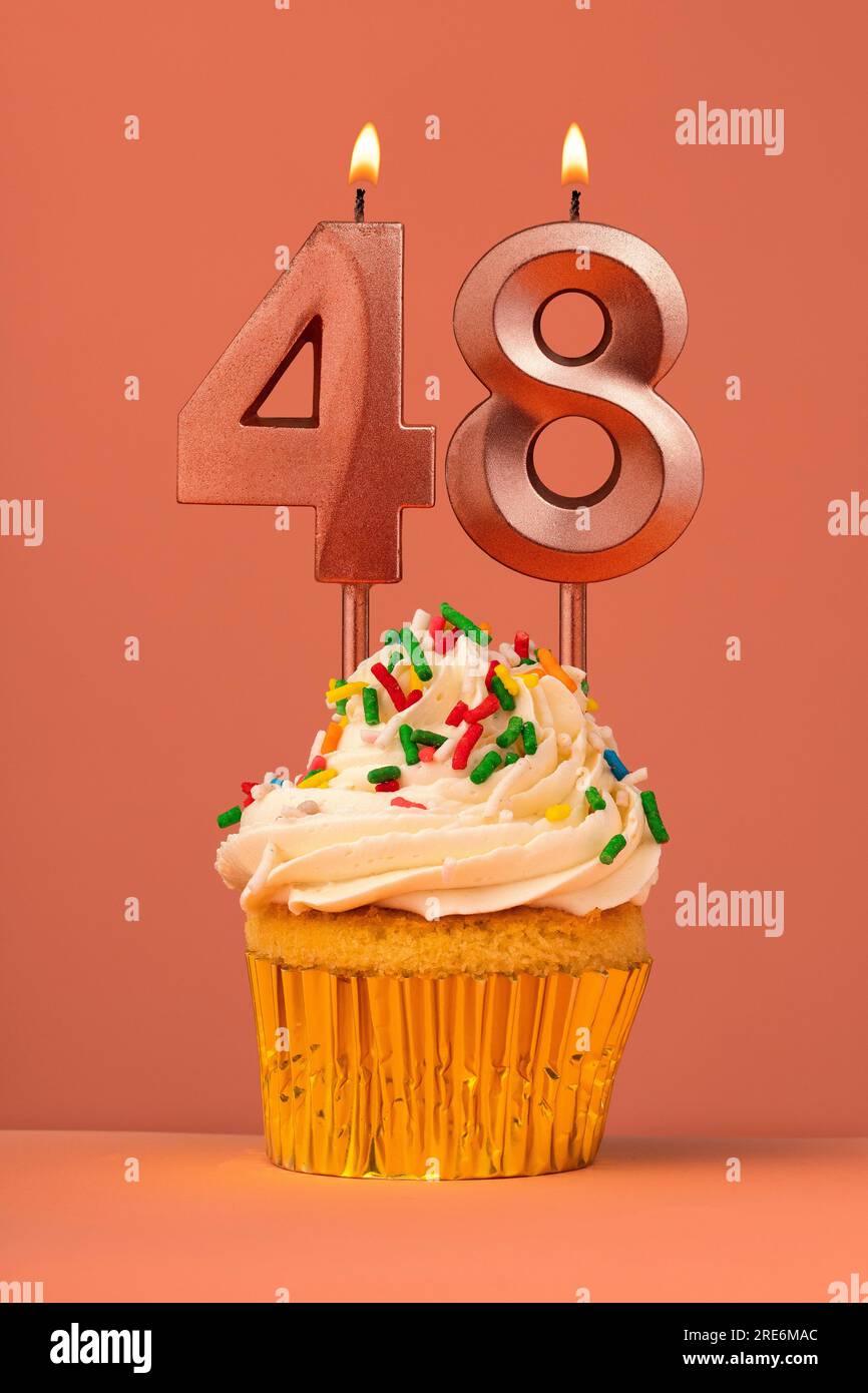 Candle number 48 - Cake birthday in coral fusion background Stock Photo ...