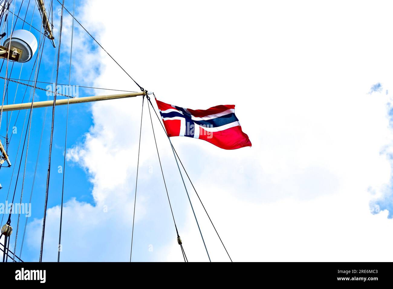 Flag of Norway, blue sky and white clouds Stock Photo - Alamy