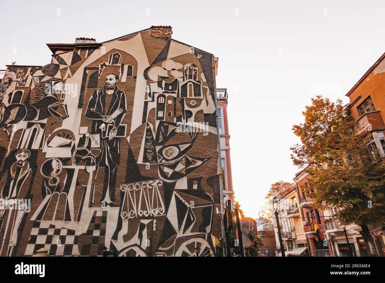 sun sets down an old town street in Plovdiv, Bulgaria. Featuring a ...