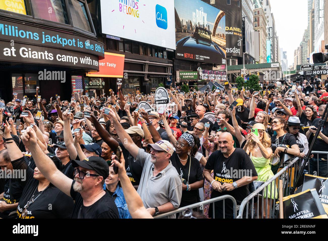 New York, USA. 25th July, 2023. Union members holding membership cards ...