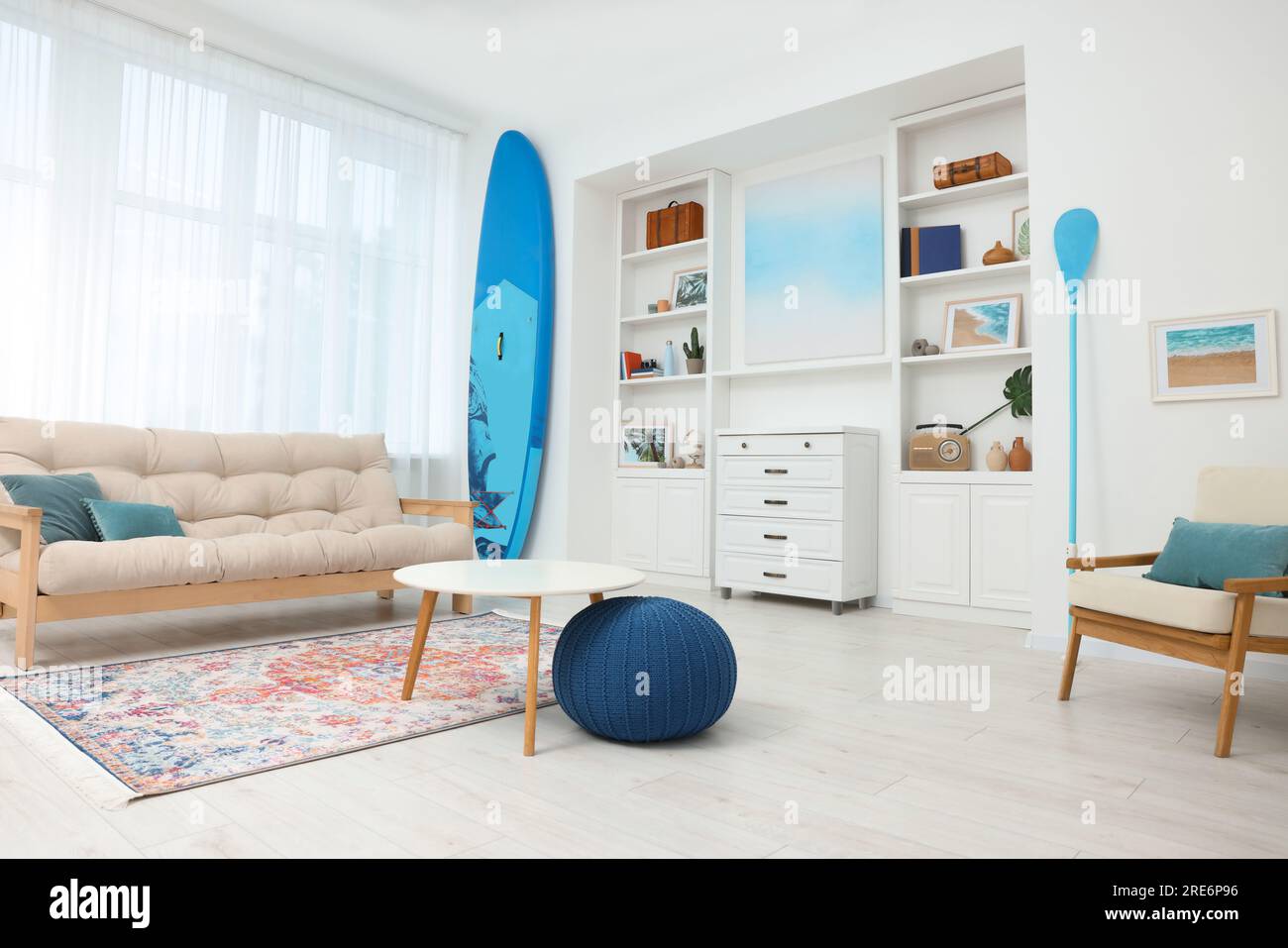 SUP board, shelving unit with different decor elements, table and pouf ...