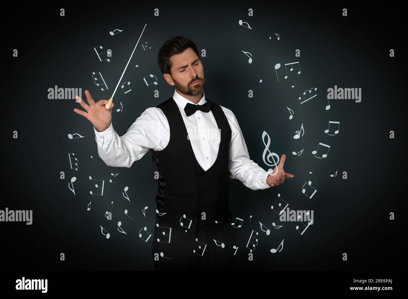 Conductor with baton and music notes on dark background Stock Photo - Alamy