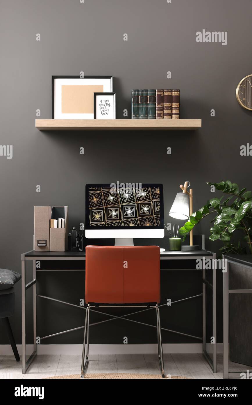 Cozy workspace with computer on metal desk at home Stock Photo - Alamy