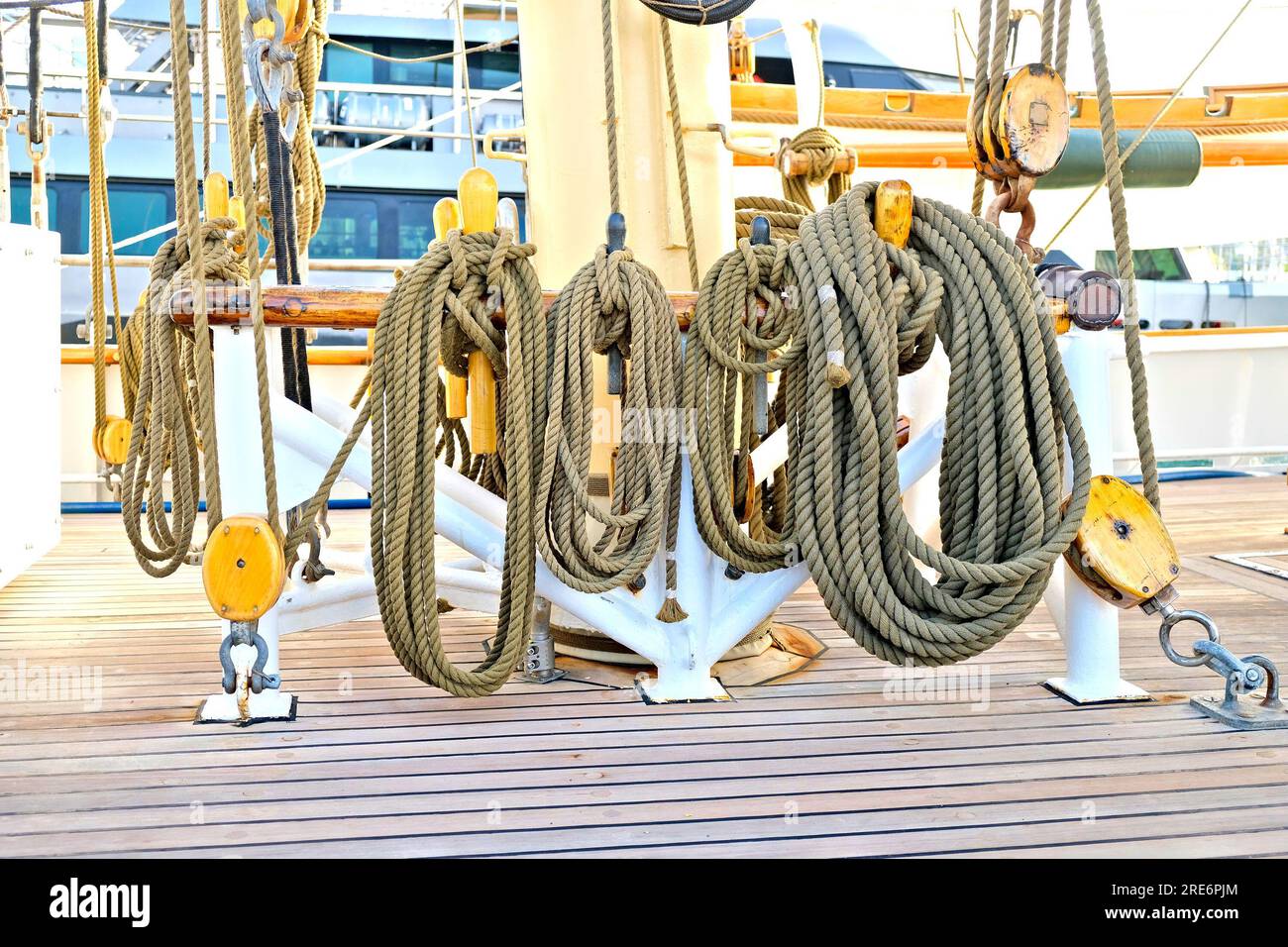 Hempen lines neatly coiled on a beautiful vintage classic sailing ship ...