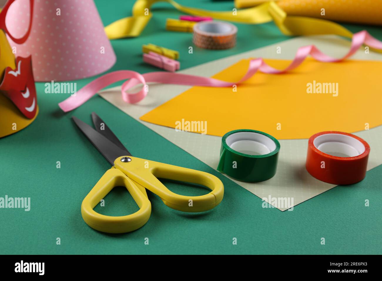 Handmade party hat. Template and tools on green background, closeup ...