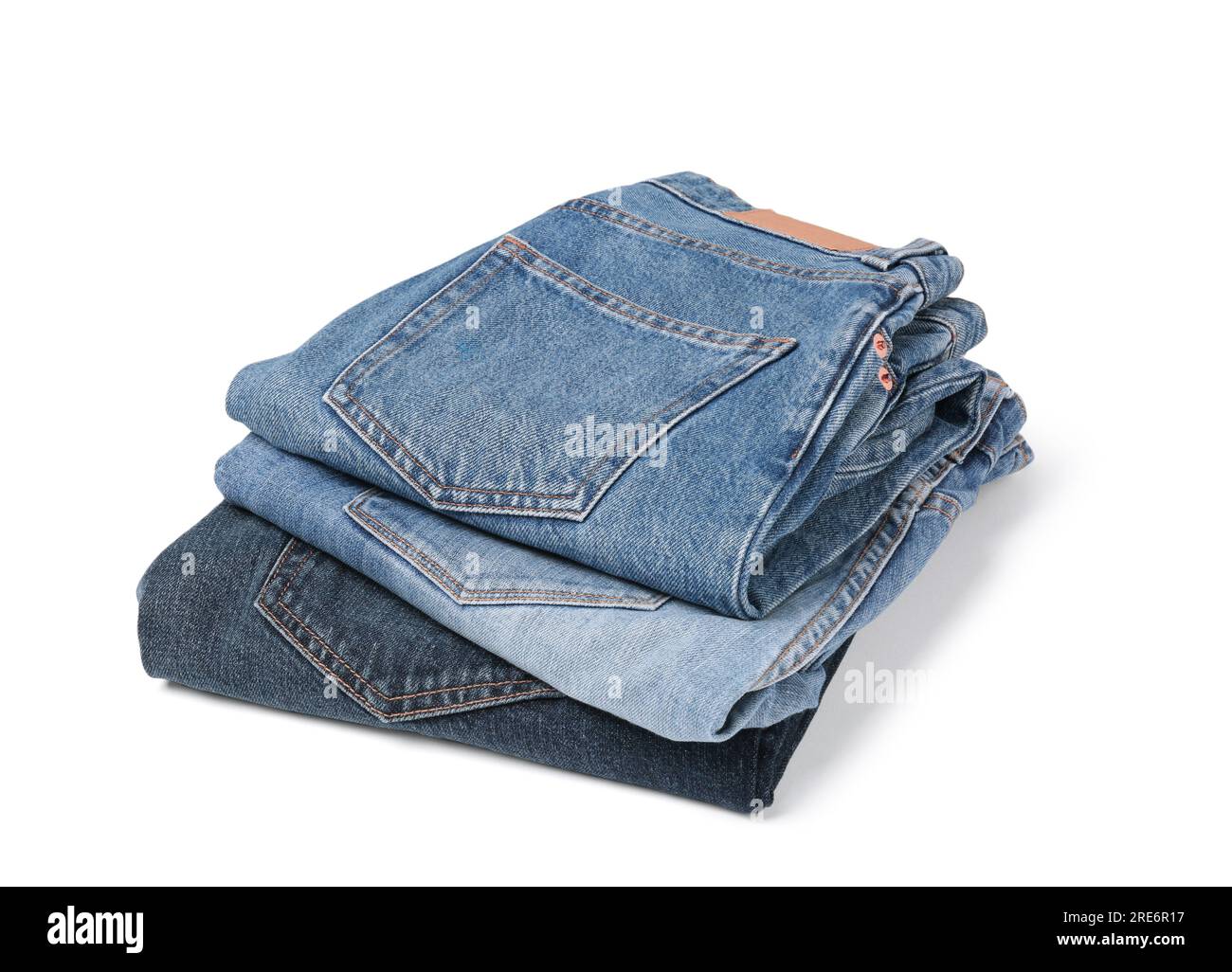 Stack of different folded jeans isolated on white Stock Photo - Alamy
