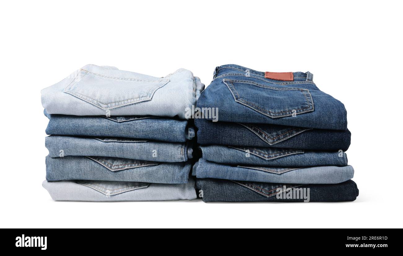 Stacks of different folded jeans isolated on white Stock Photo - Alamy