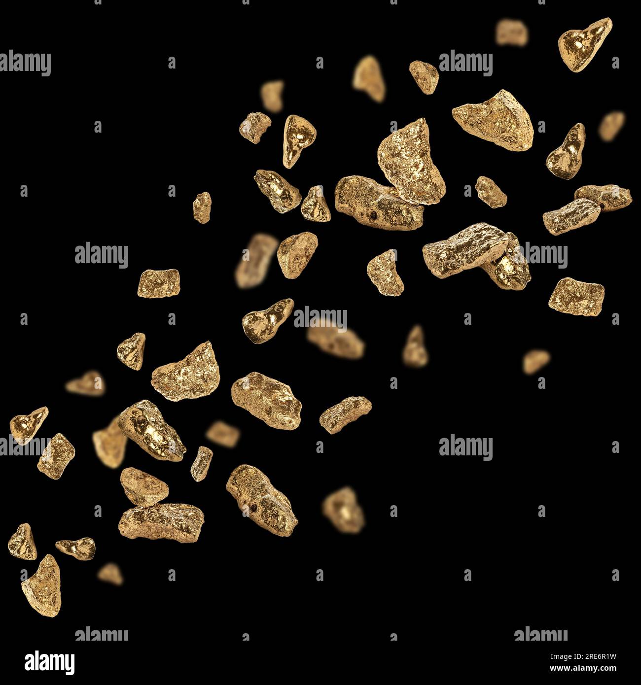 Many gold nuggets flying on black background Stock Photo - Alamy