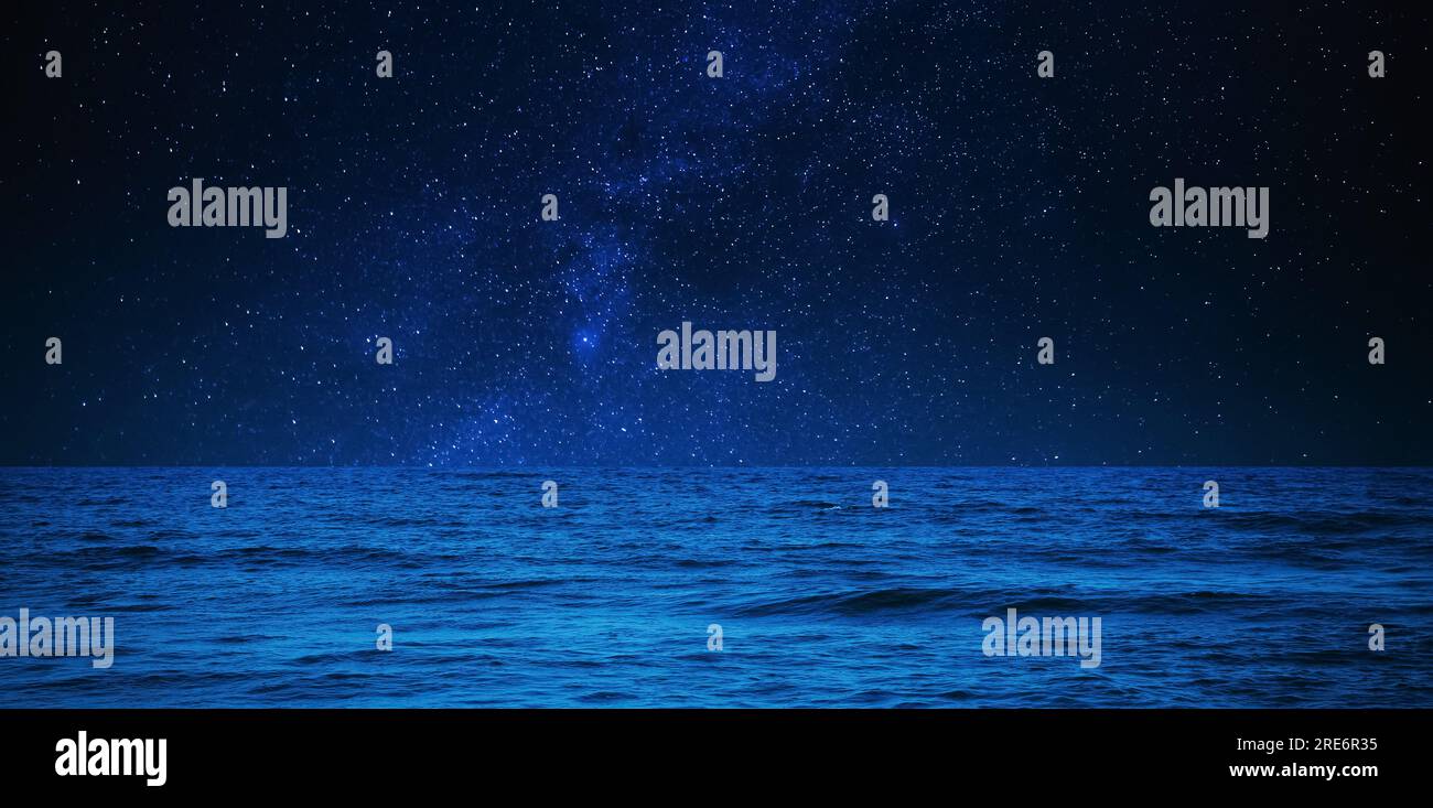 Amazing starry sky over sea at night Stock Photo - Alamy