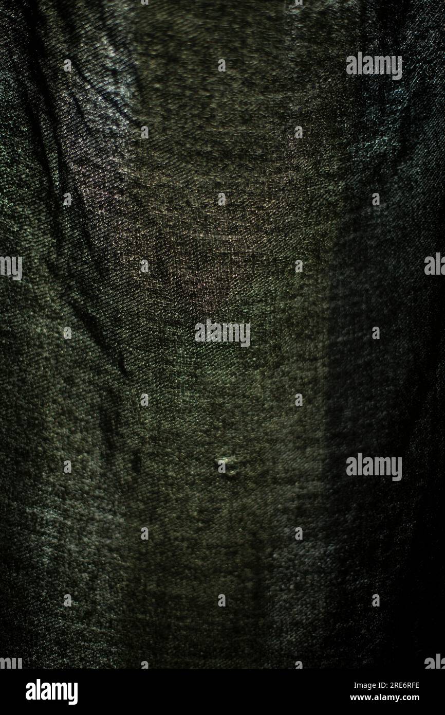 Curtains on window. Light through dark fabric. Texture of fabric in ...