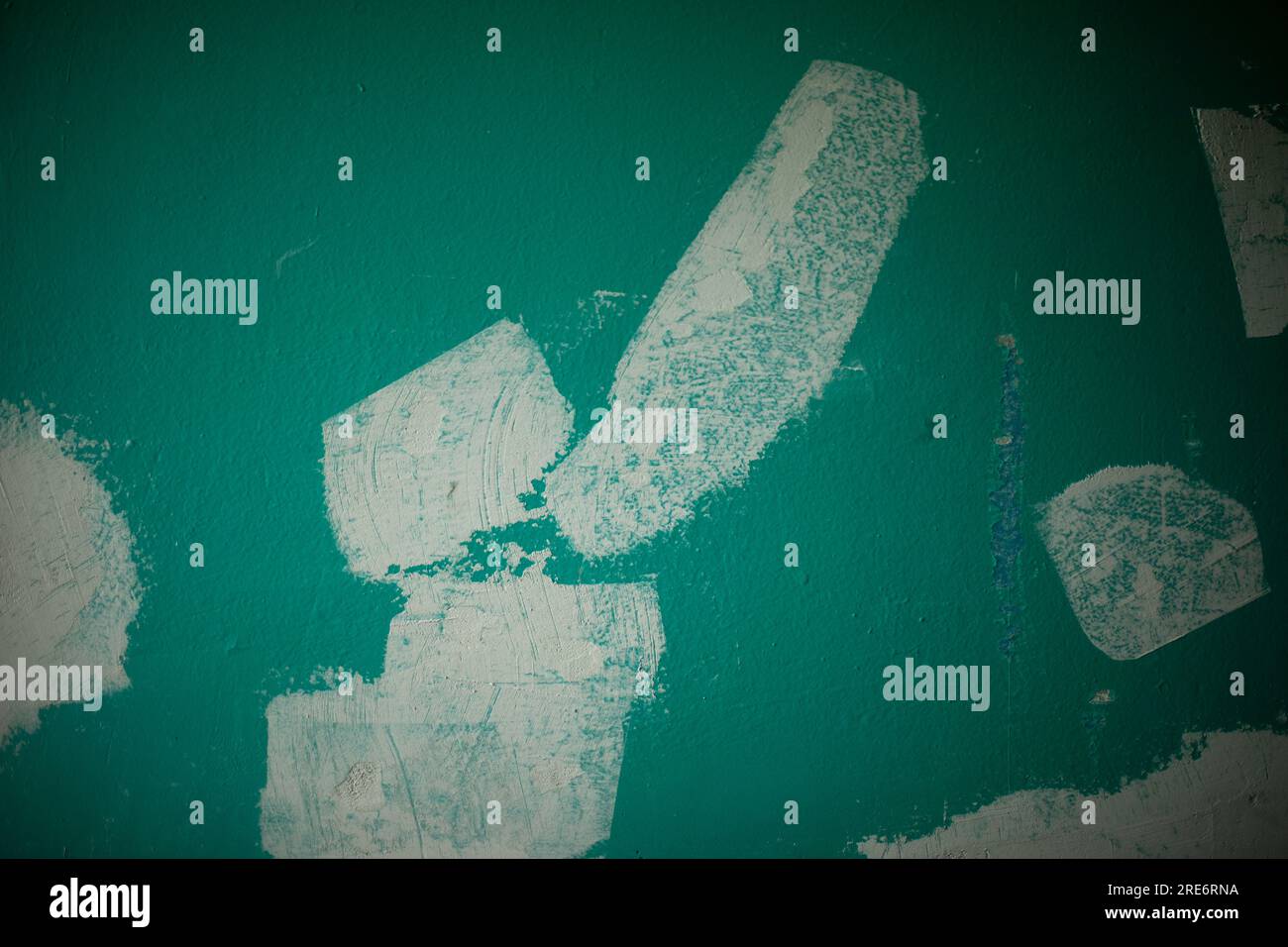 Repairing wall. White spots on green. Wall alignment. Paint application ...