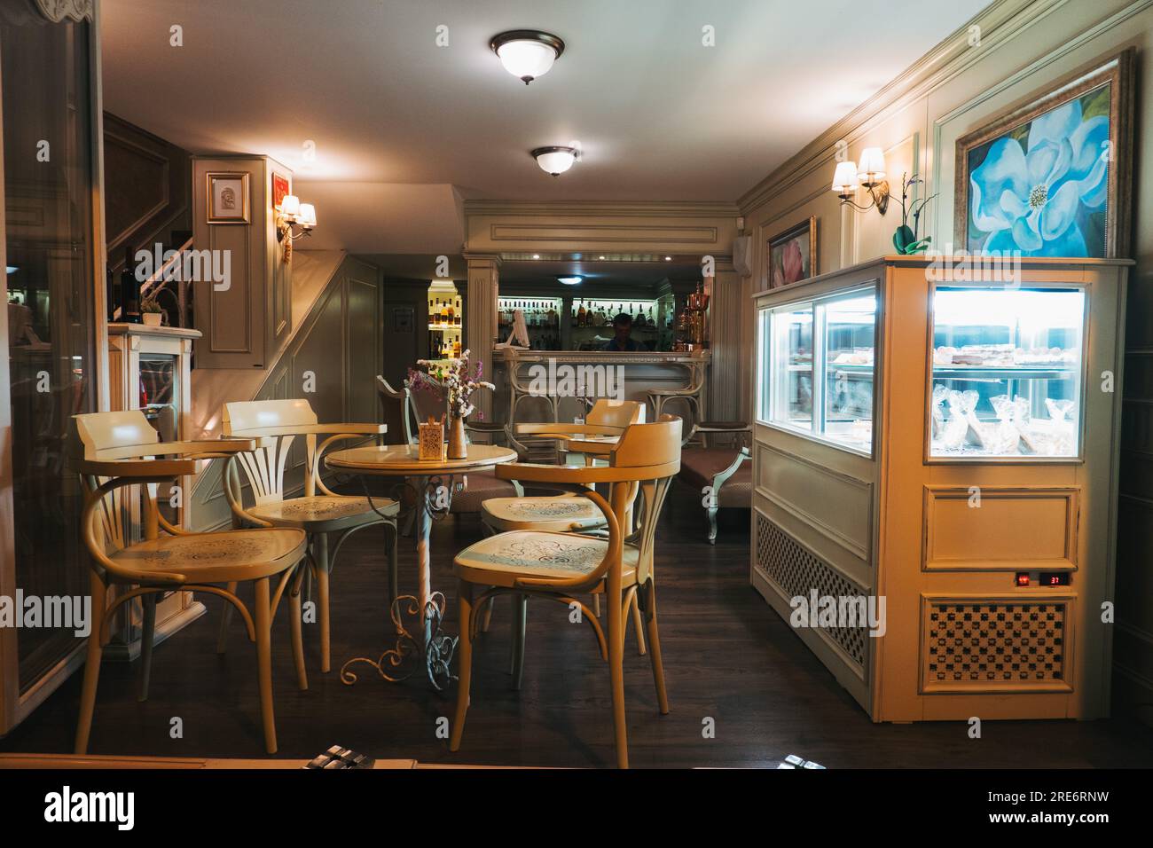 an empty wooden table and chairs in a restaurant at night in Plovdiv ...