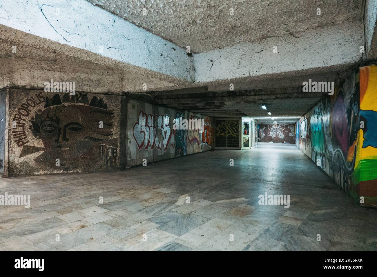 a concrete underground pedestrian walkway in Plovdiv, Bulgaria, covered ...