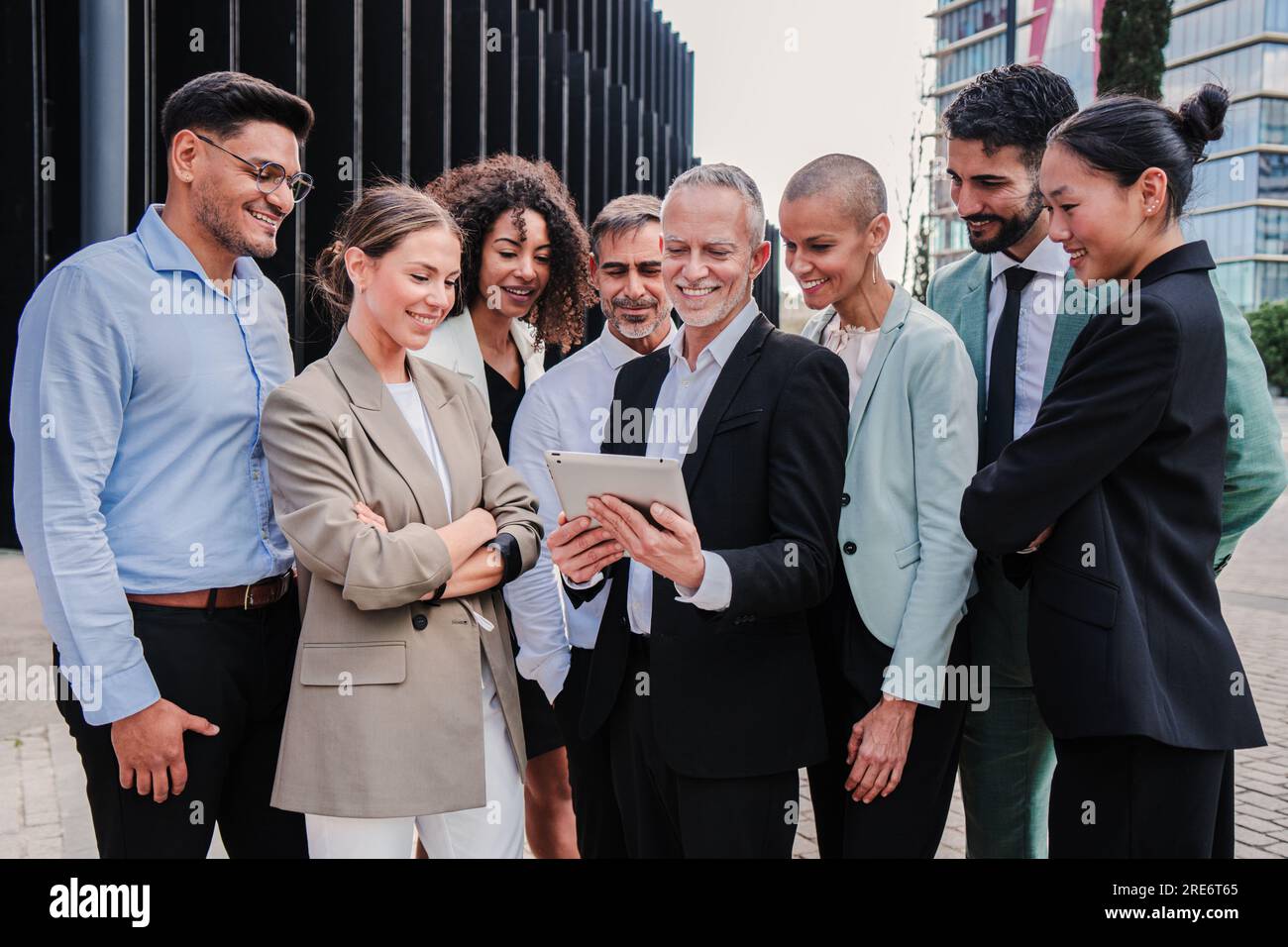Startup business team talkingand using a tablet to share ideas on a ...