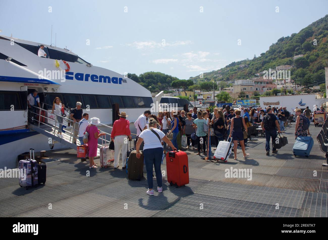 Passengers disembarking a Caremar catamaran ferry at Ischia Porto on the Island of Ischia, bay ...