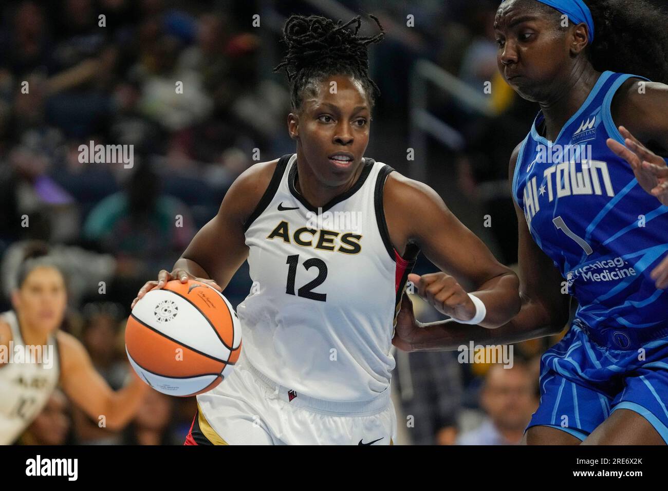 Las Vegas Aces guard Chelsea Gray, left, dribbles the ball around ...