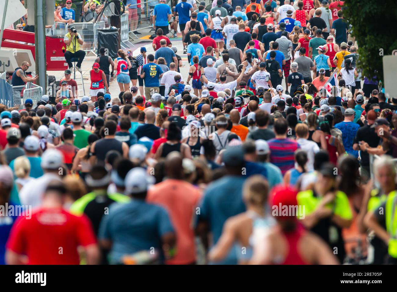 Atlanta, GA / USA - July 4, 2023: Massive crowd of runners nears the ...