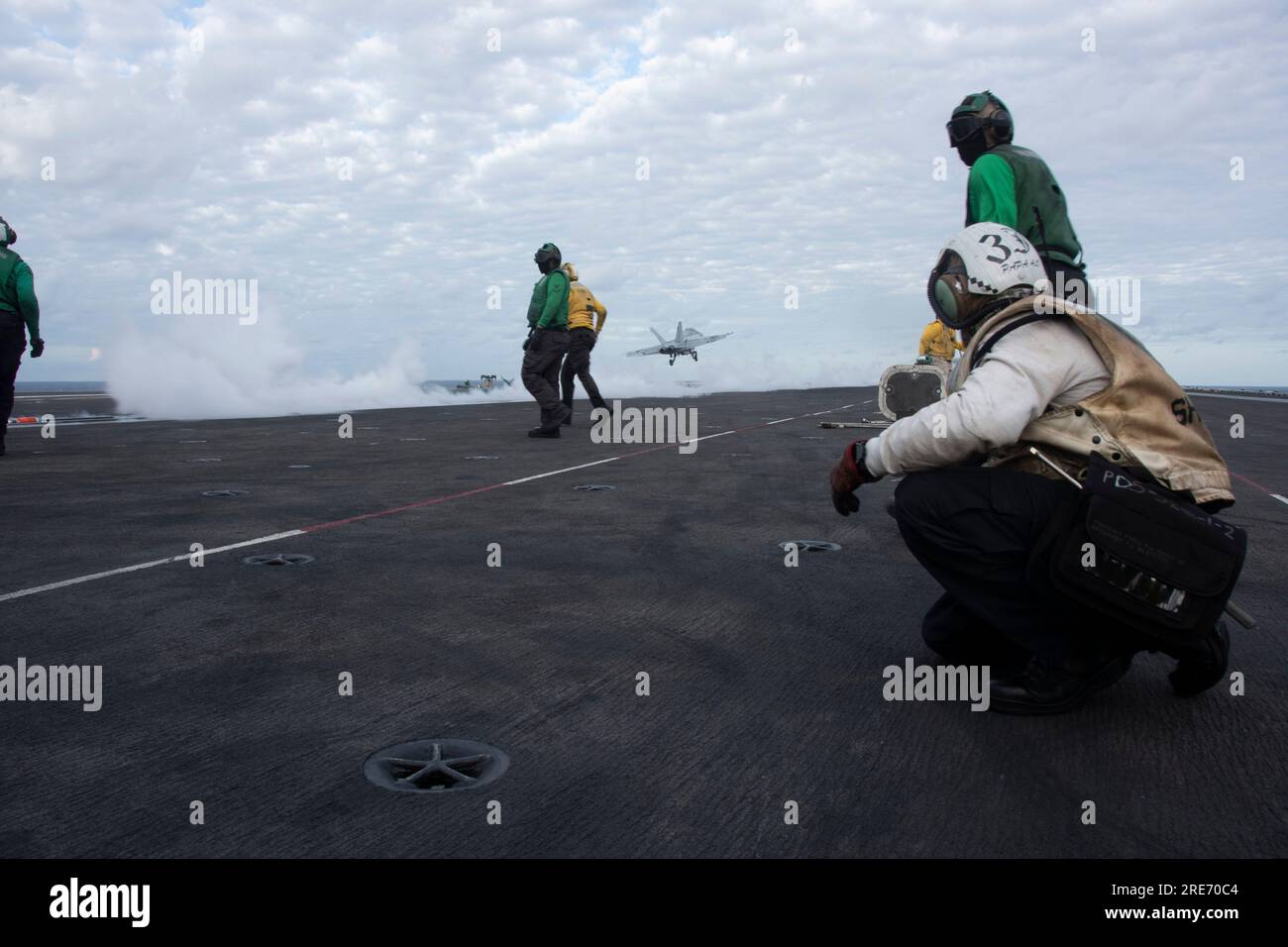 INDIAN OCEAN (July 21, 2023) Sailors observe as an F/A-18F Super Hornet ...