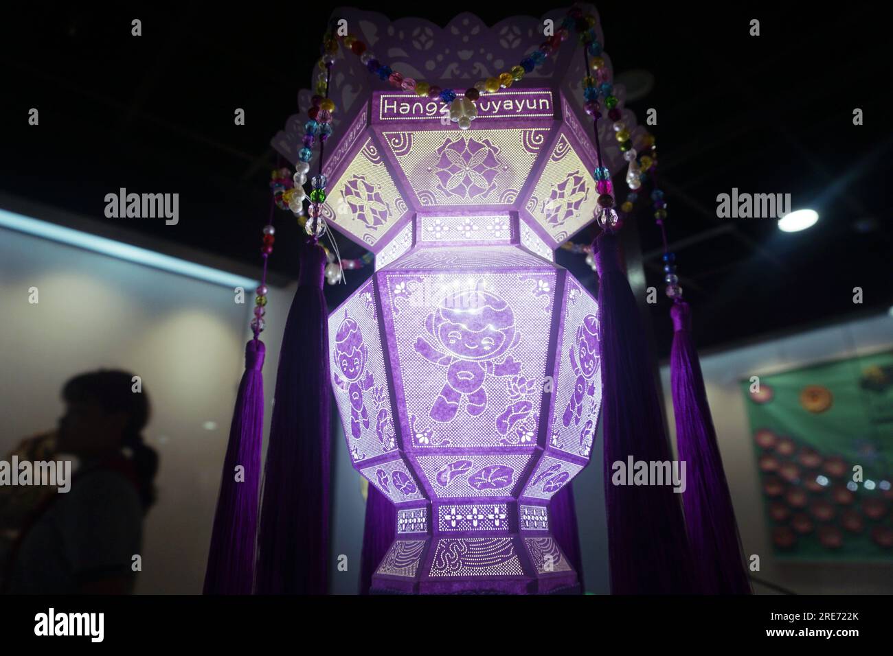 HANGZHOU, CHINA - JULY 25, 2023 - Visitors look at an embroidery work ...