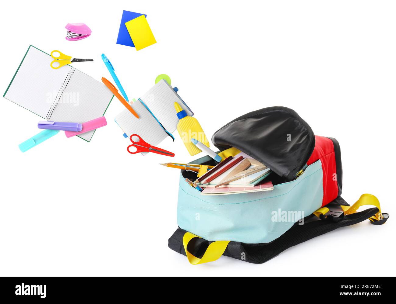 School backpack with flying stationery on white background Stock Photo ...