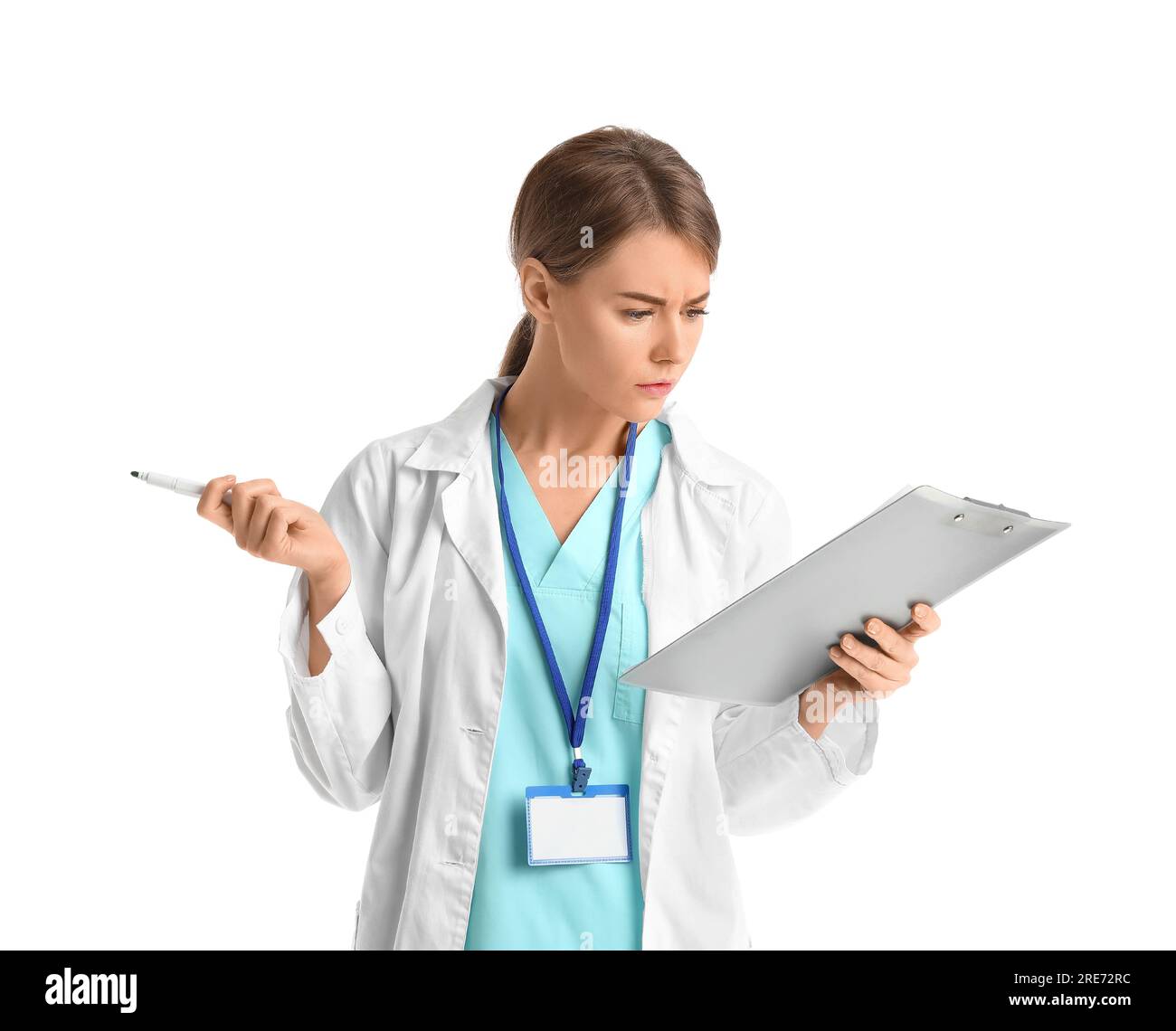 Upset female doctor with clipboard on white background Stock Photo - Alamy