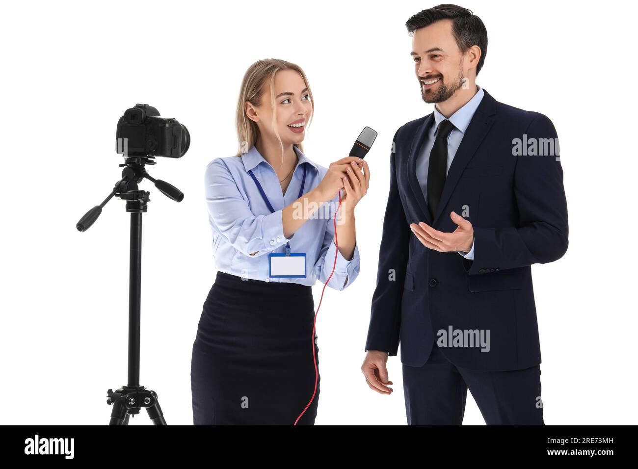 Female journalist with microphone having an interview with businessman ...