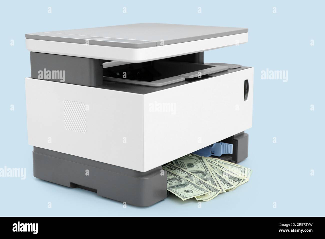 Laser printer with dollar banknotes on light background Stock Photo - Alamy