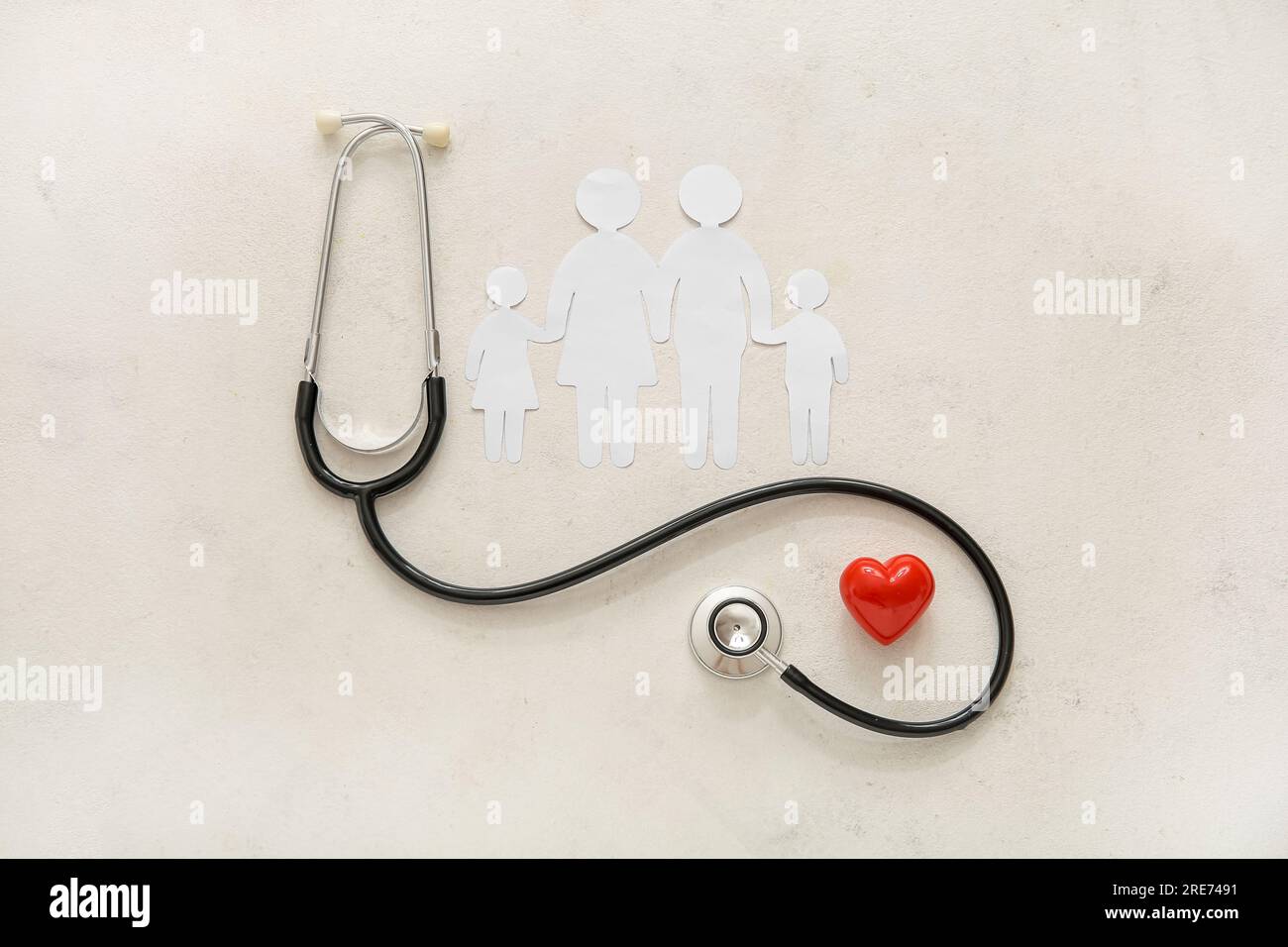 Figures of family and stethoscope with heart on grunge beige background ...
