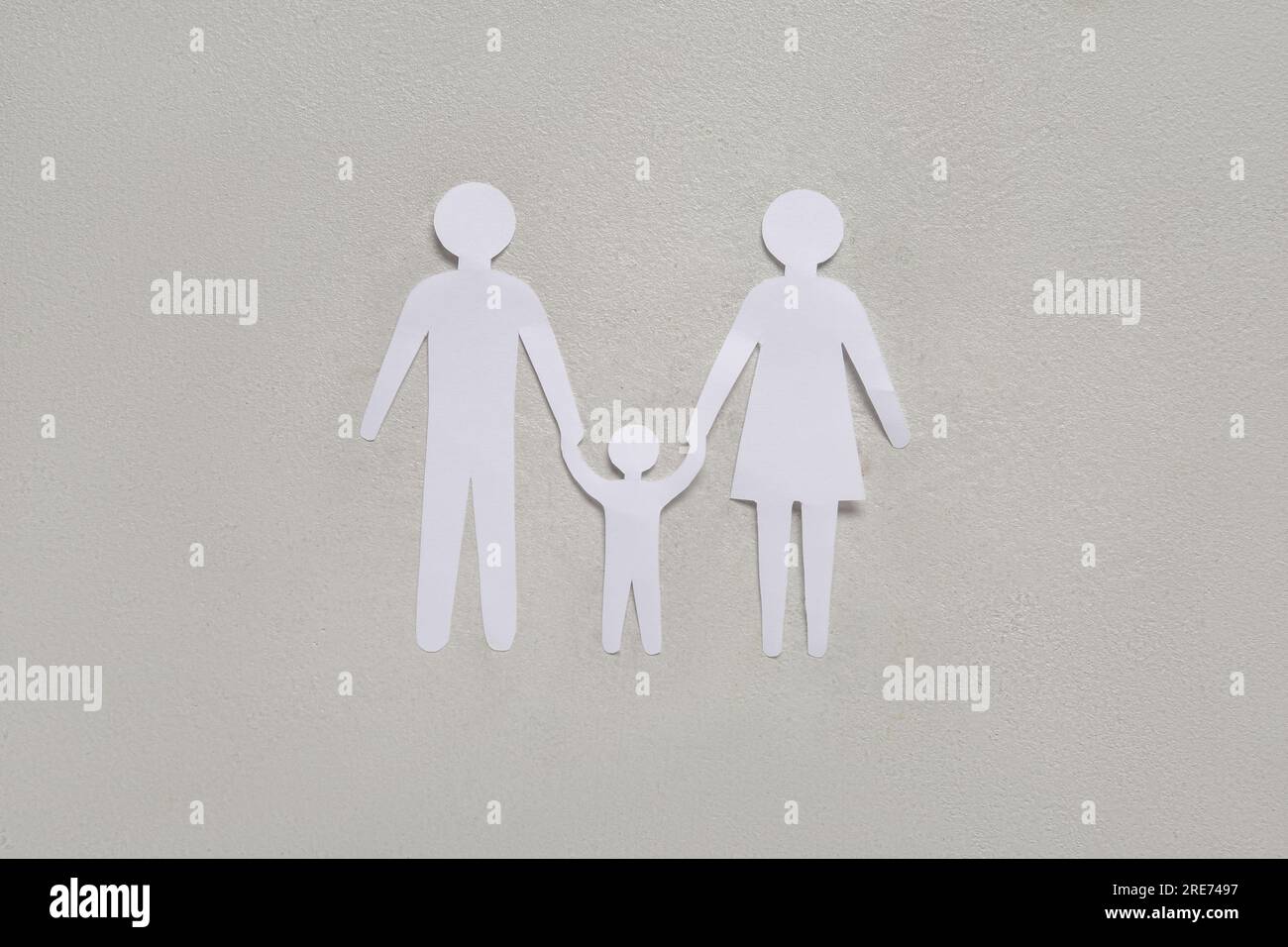 Figures of family on grunge grey background Stock Photo - Alamy