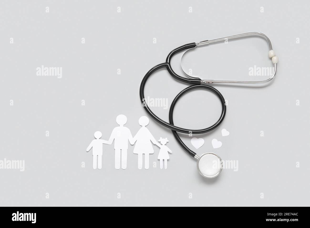 Figures of family with stethoscope on grey background. Health care ...