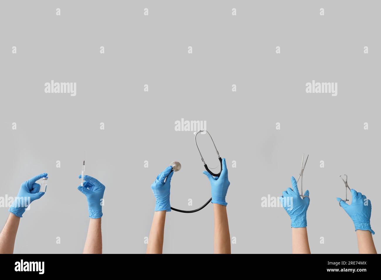 Female doctor's hands with medical tools on grey background Stock Photo ...