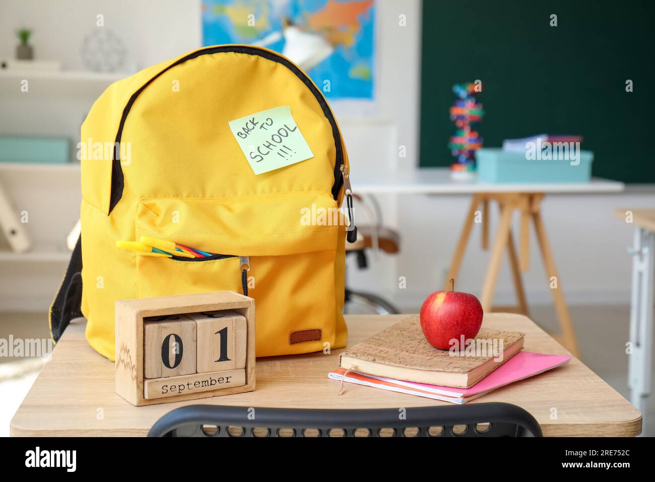 Backpack, stationery, calendar and sticky note with text BACK TO SCHOOL ...