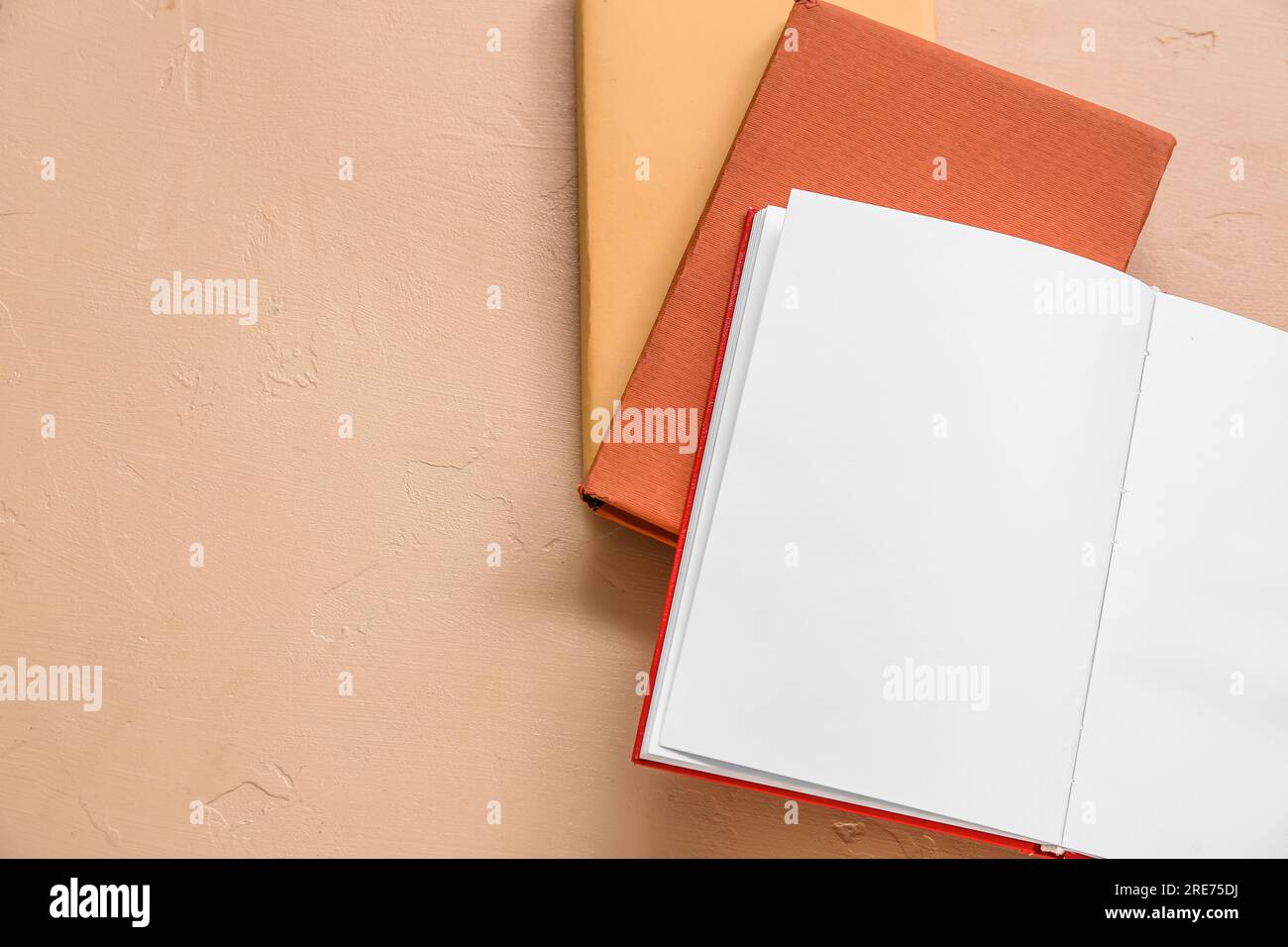 Open book with blank pages on beige background Stock Photo - Alamy