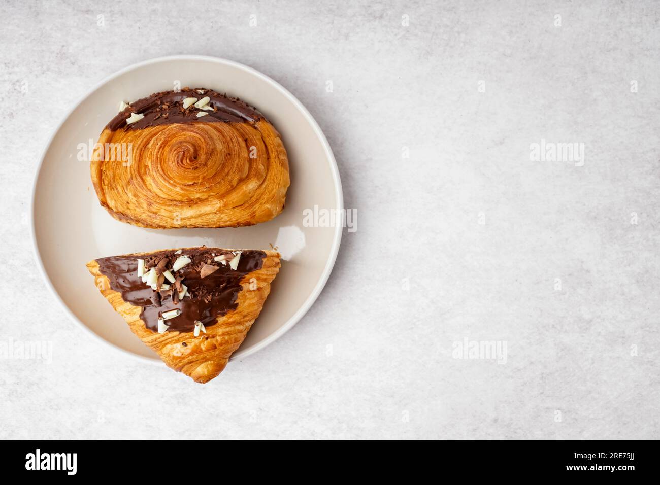 Plate of sweet croissant with chocolate on white background Stock Photo ...