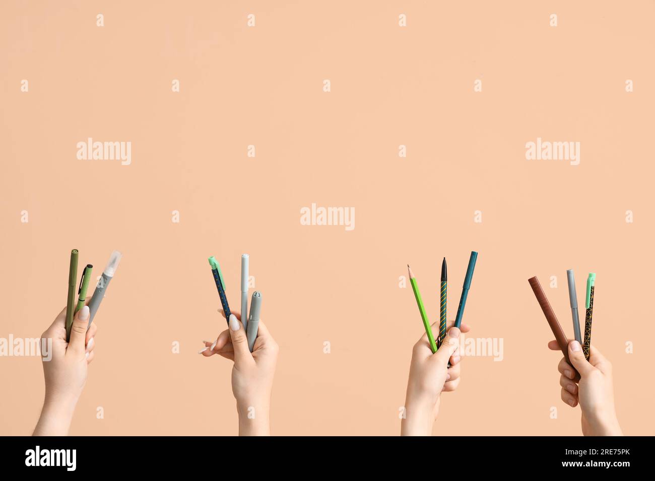 Female hands with school supplies on beige background Stock Photo - Alamy