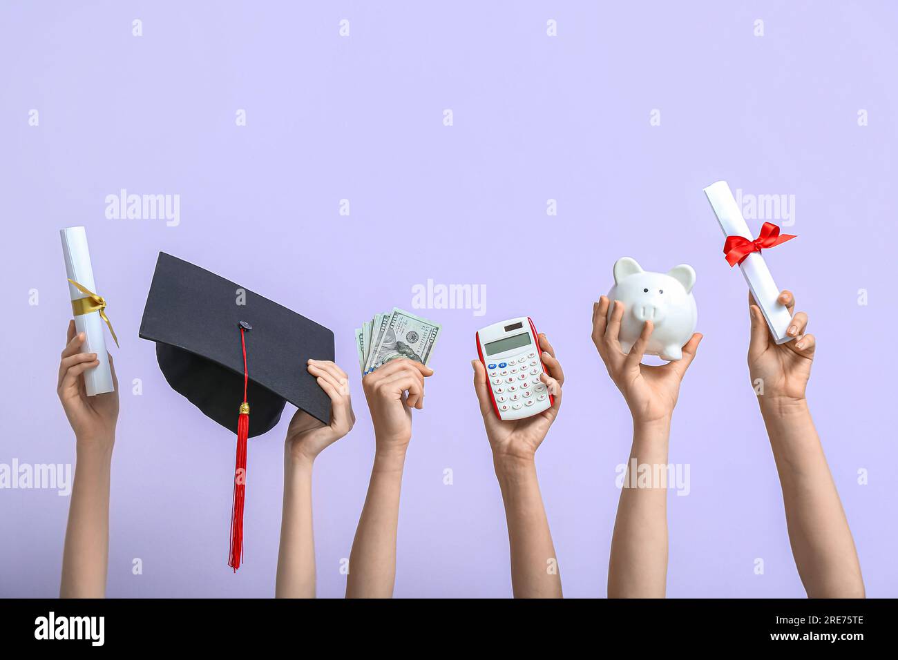 Female hands holding piggy bank, graduation cap, diplomas and money on ...