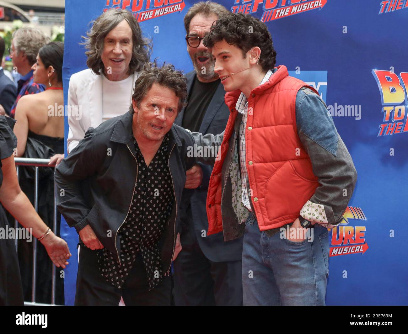 Actor Michael J. Fox, left, greets actor Casey Likes from the Broadway musical "Back to the ...