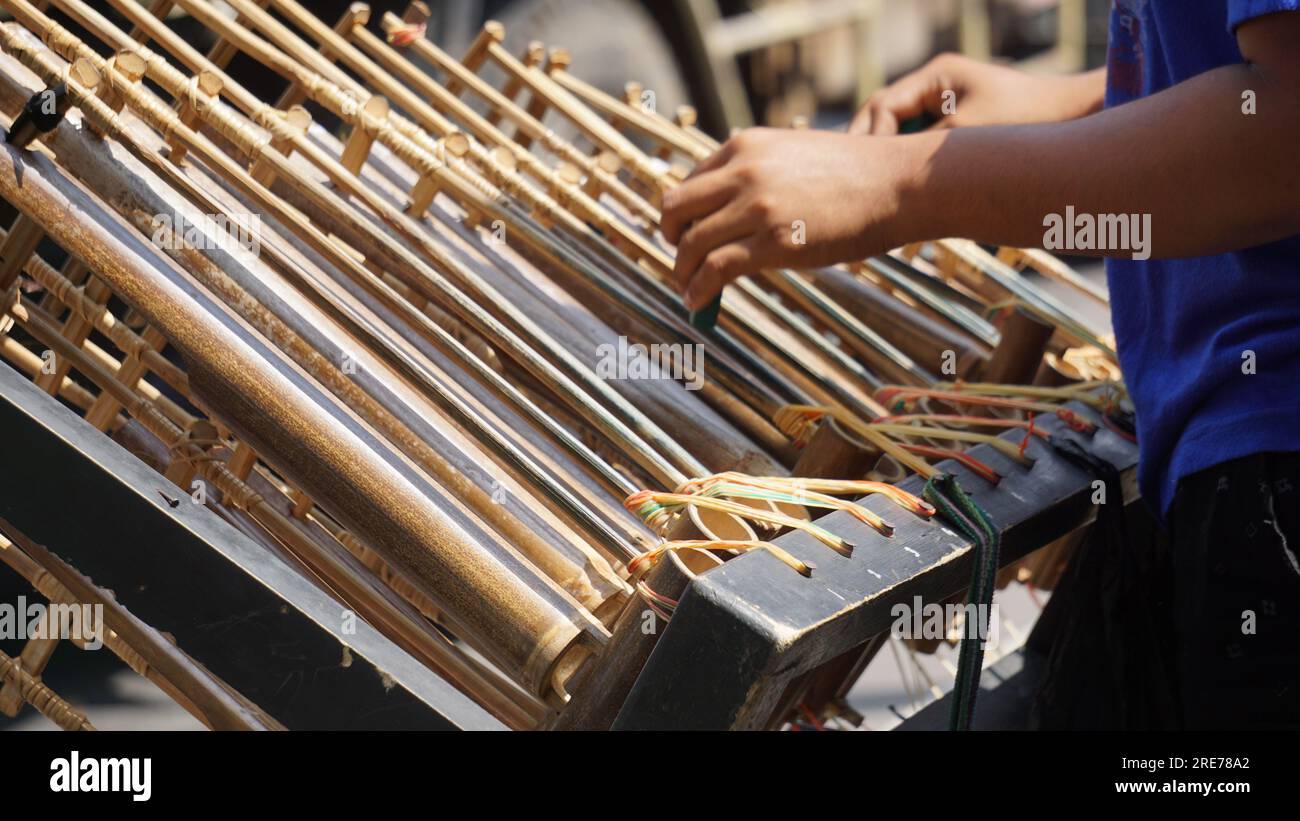 Man playing angklung multitonal hi-res stock photography and images - Alamy