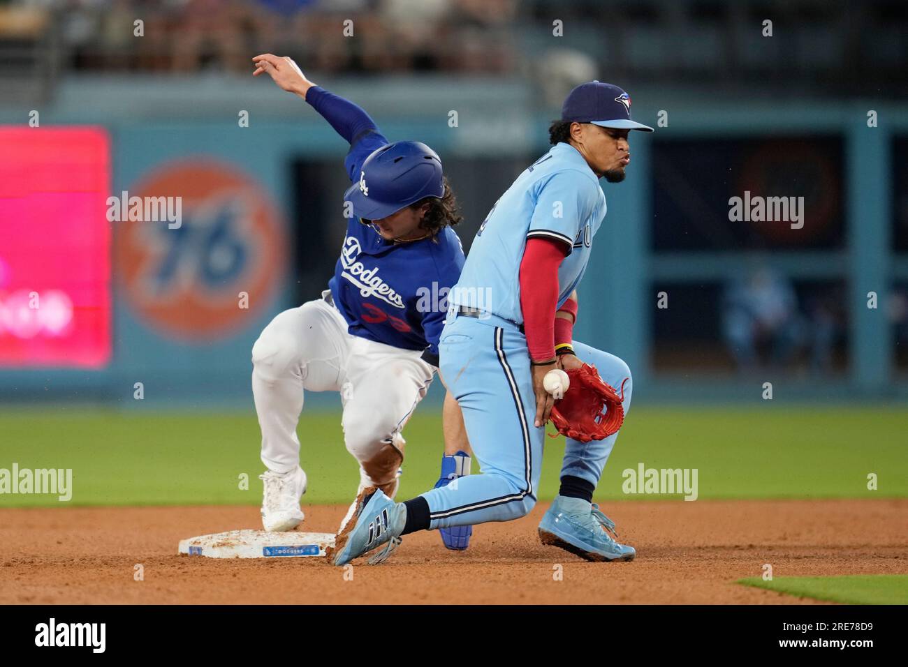 Los Angeles Dodgers' James Outman, left, steals second base past ...