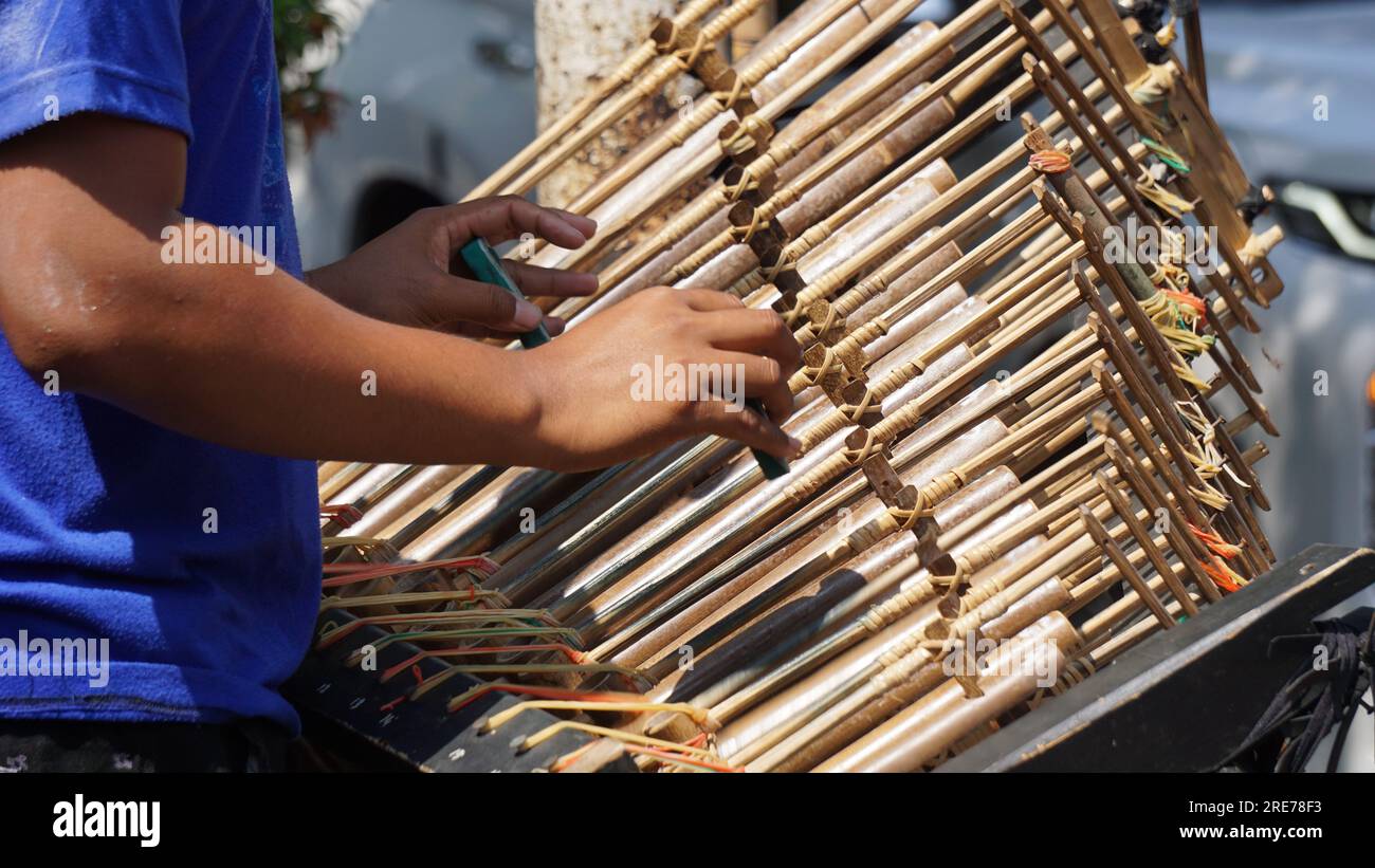 Man playing angklung multitonal hi-res stock photography and images - Alamy