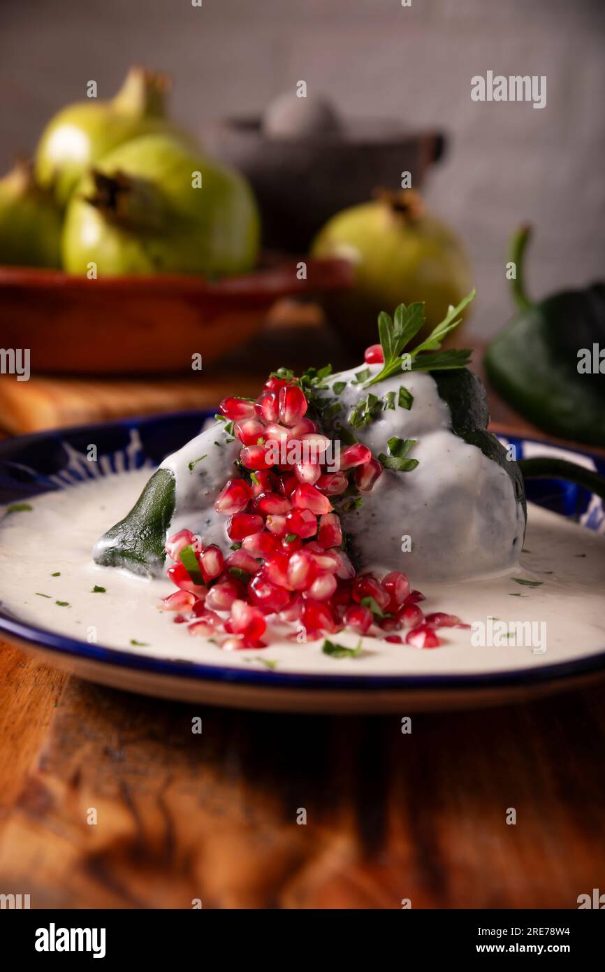 Chiles en Nogada, Typical dish from Mexico. Prepared with poblano chili ...