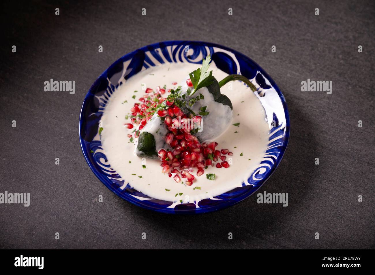Chiles en Nogada, Typical dish from Mexico. Prepared with poblano chili ...