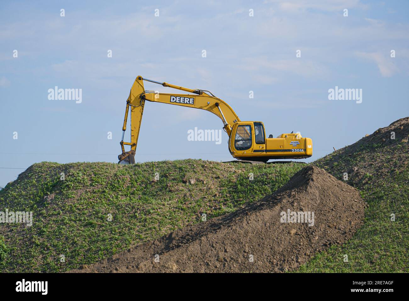 27 July 2023 - Calgary Alberta Canada - Excavator tractor on pile of ...