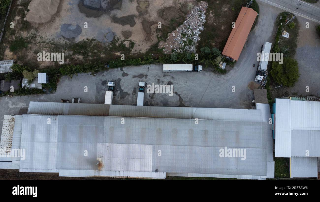 Aerial view of parked trailer truck loading parcel boxes at warehouse ...