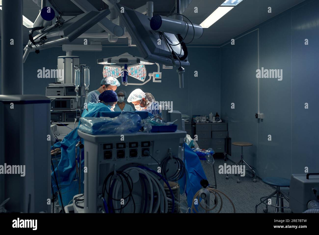 Surgeons team during complex surgical operation in a sterile operating ...