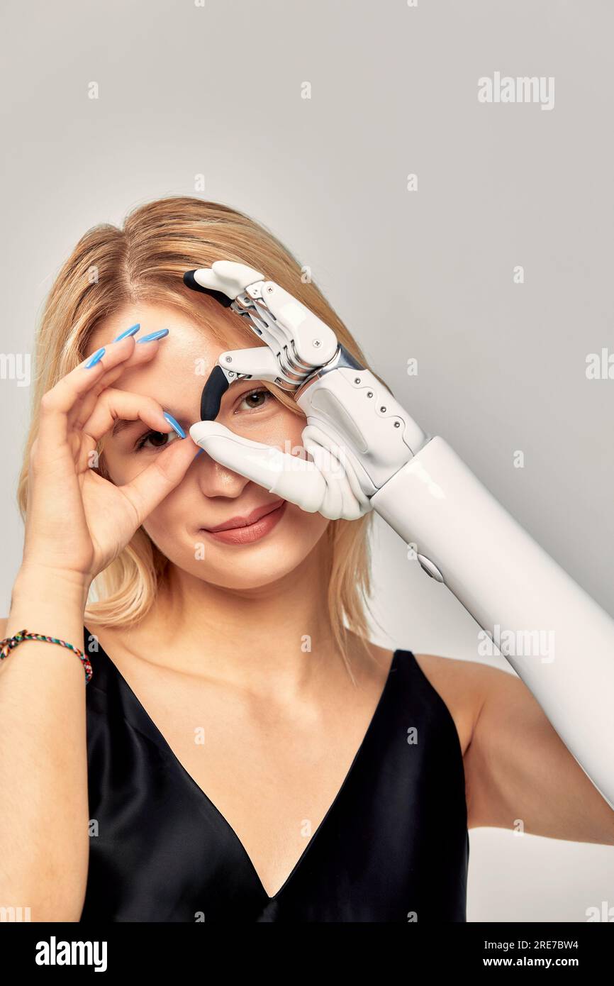 Close up of young charming girl with disability wearing sensory bionic ...