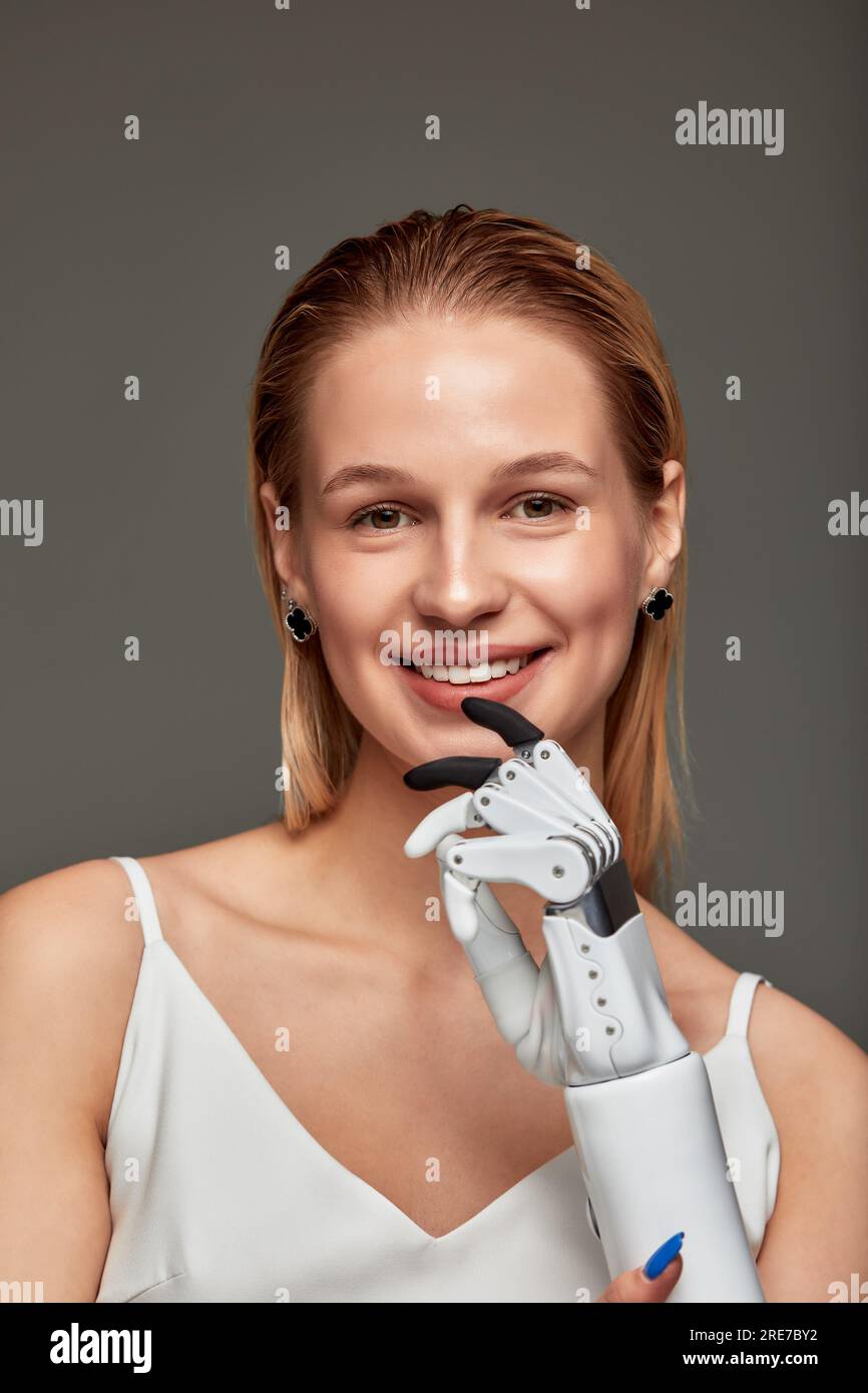 Close up studio portrait of charming young girl in white dress wearing ...