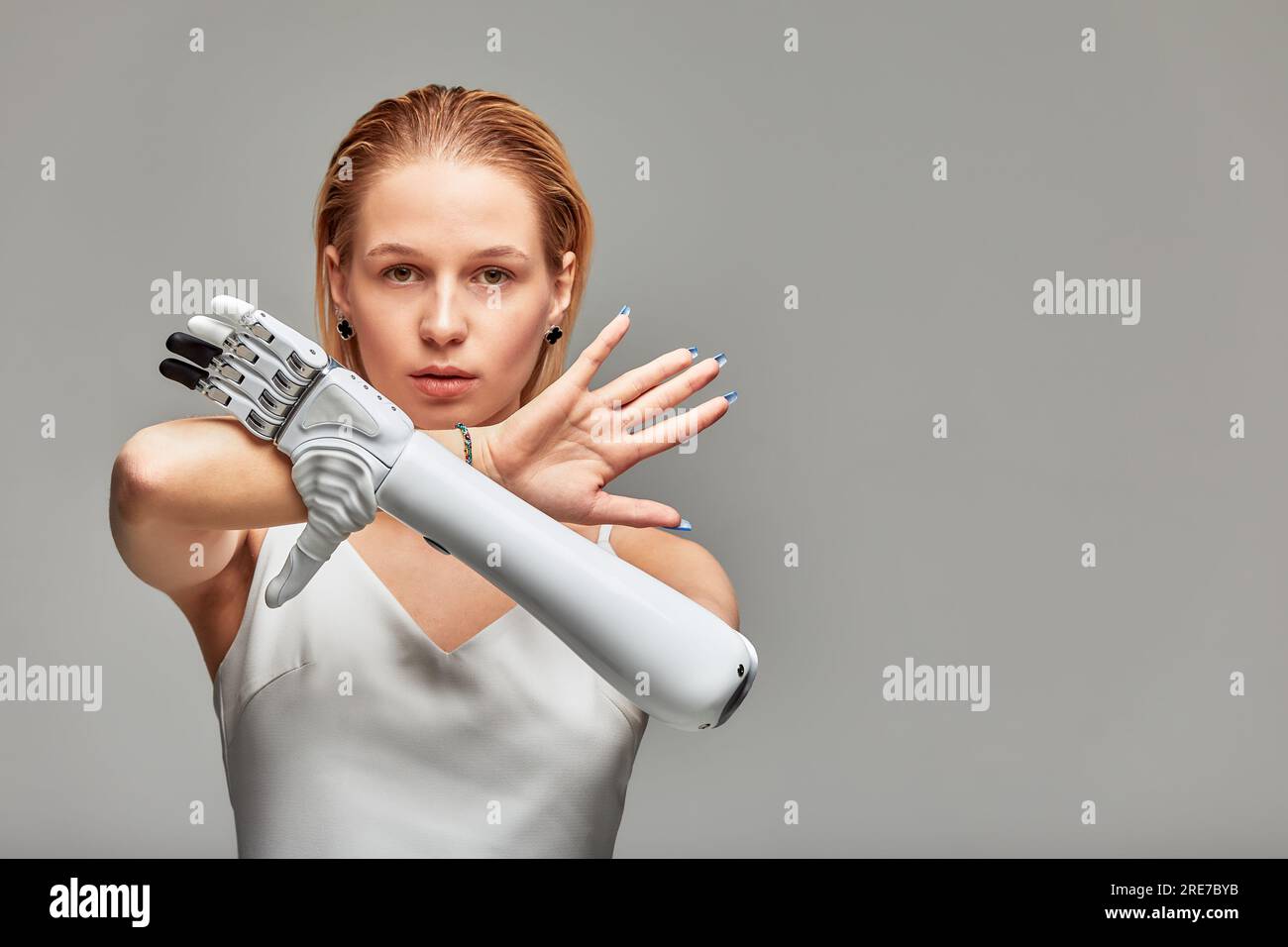 Studio portrait of beautiful young girl with disability wearing sensory ...